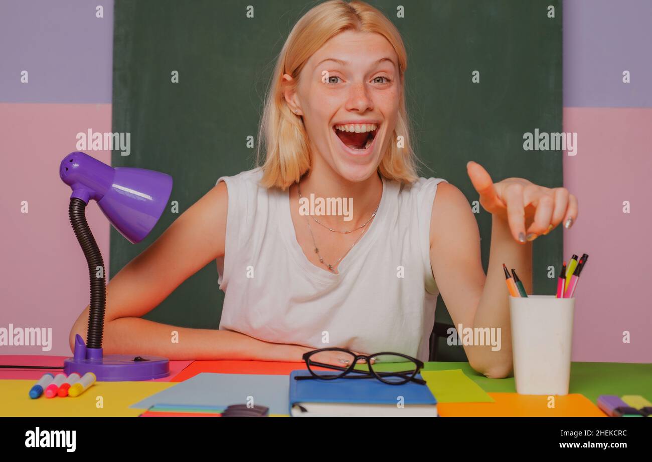 Happy funny teacher winking. Female student. Young teacher or tutor at ...