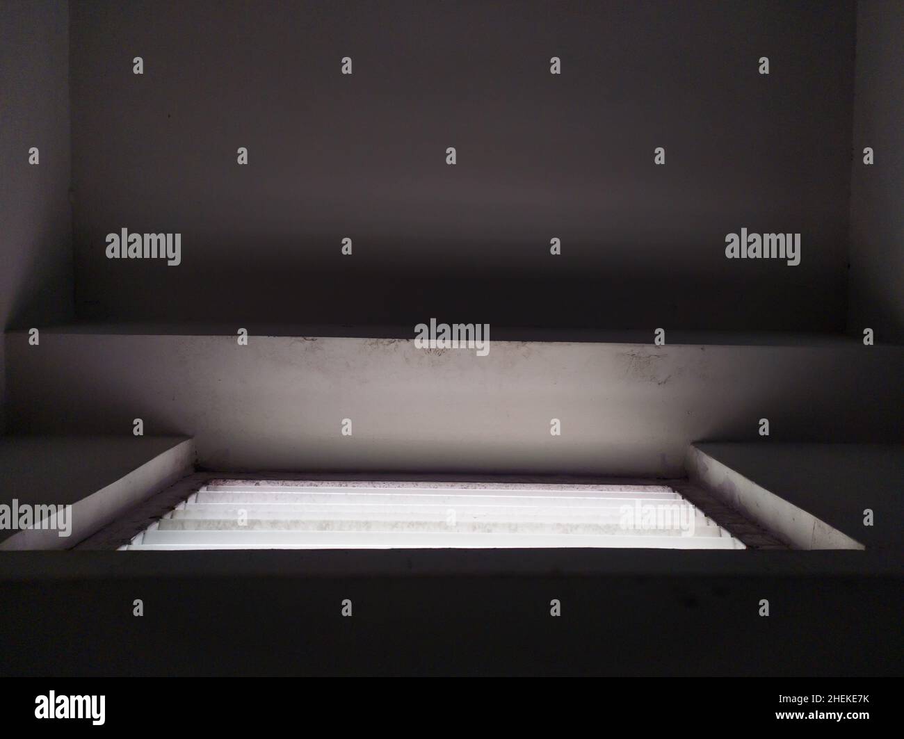 light coming through glass window in a dark room. concept shot ...