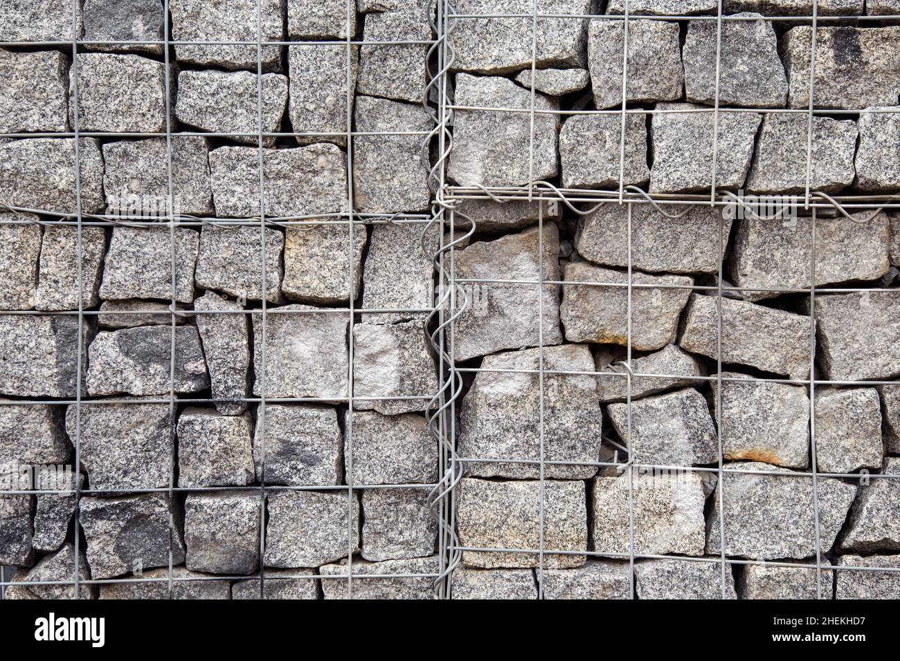 Cube shape Grey stones in Basket Gabion Wall, wire fence filled with ...