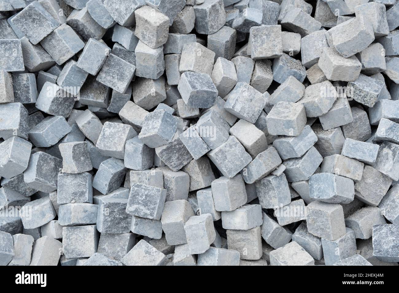 Heap of Cube shaped Grey stones granite cobblestones. Top view on ...