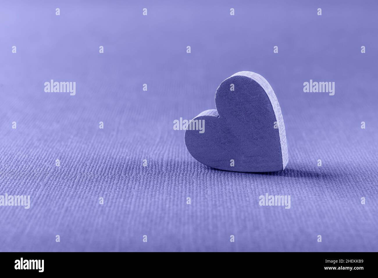 Blue violet valentine heart against textured background in trendy color ...