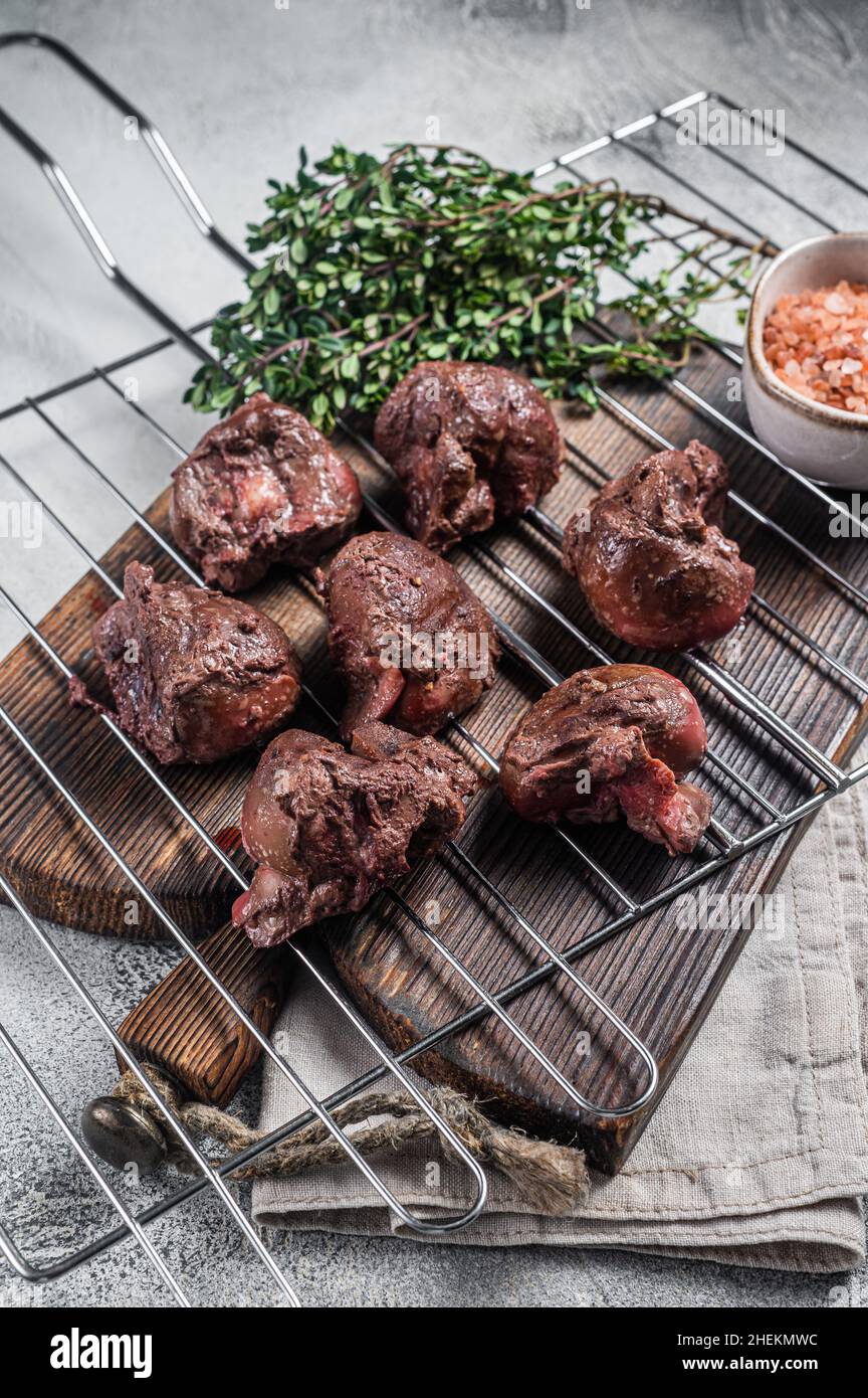 BBQ Grilled lamb mutton kidney, offal meat on grill. White background ...