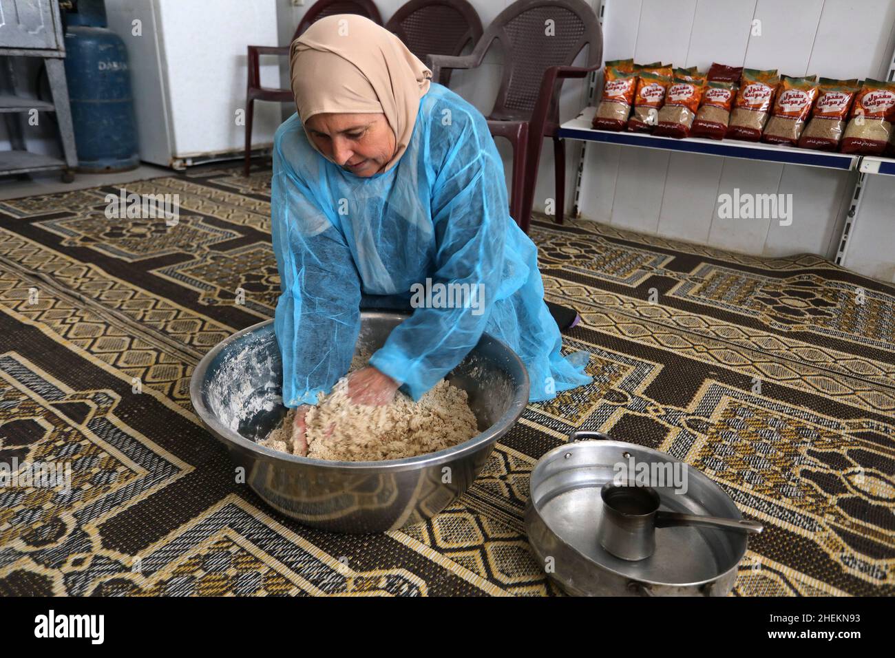 Palestinian women prepare "Maftoul", a traditional couscous dish made ...