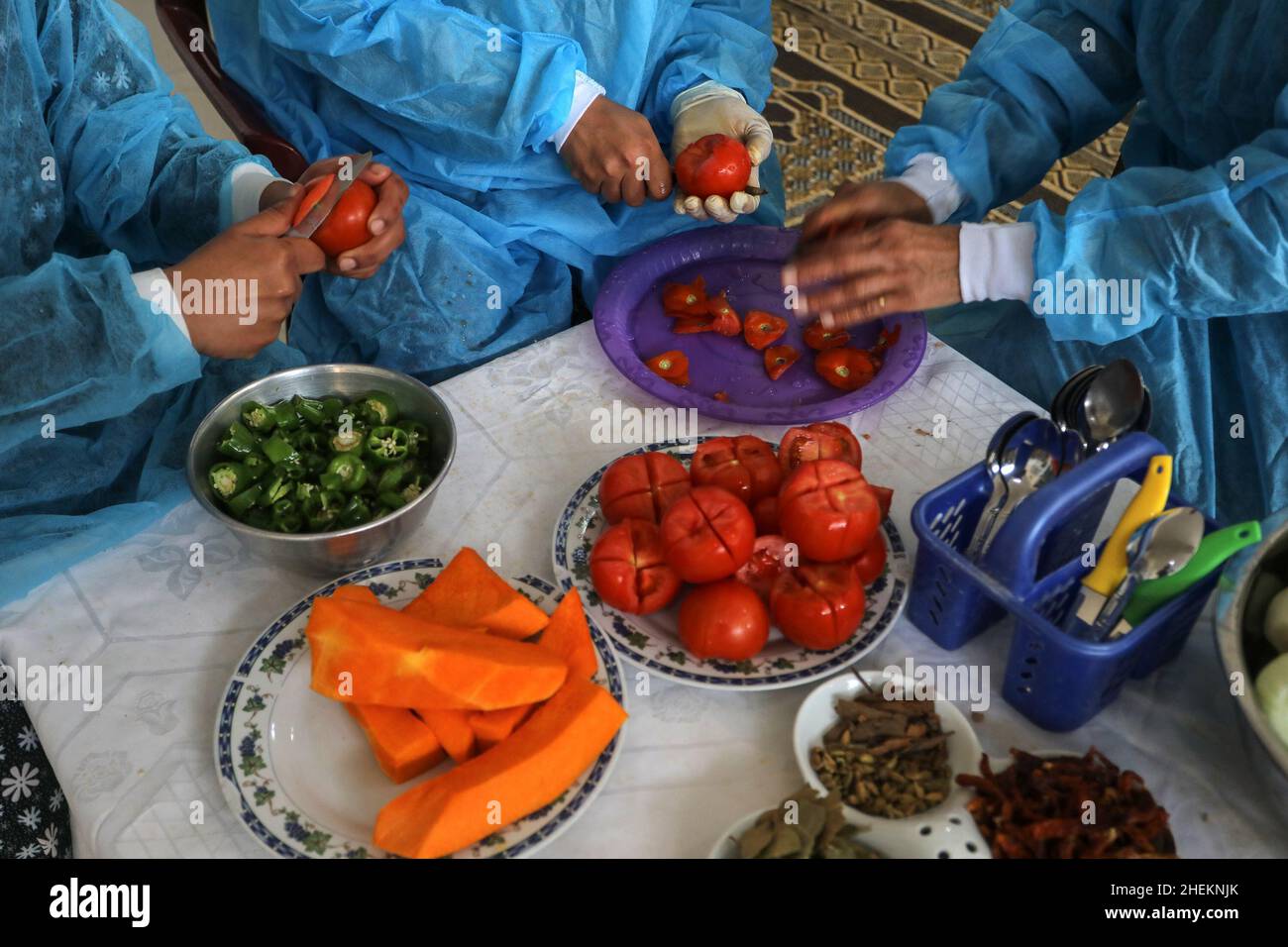 Palestinian women prepare "Maftoul", a traditional couscous dish made ...