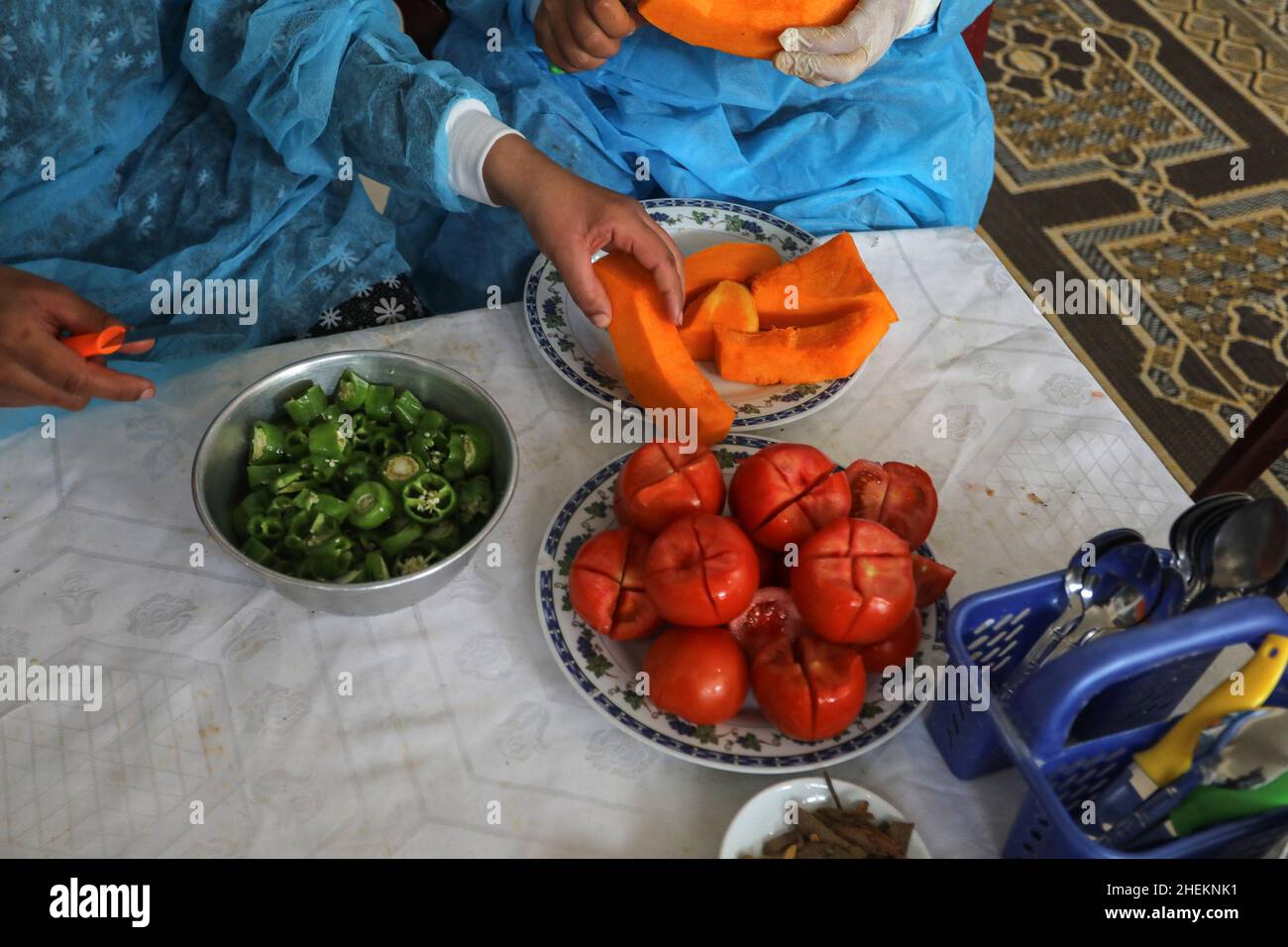 Palestinian women prepare "Maftoul", a traditional couscous dish made ...