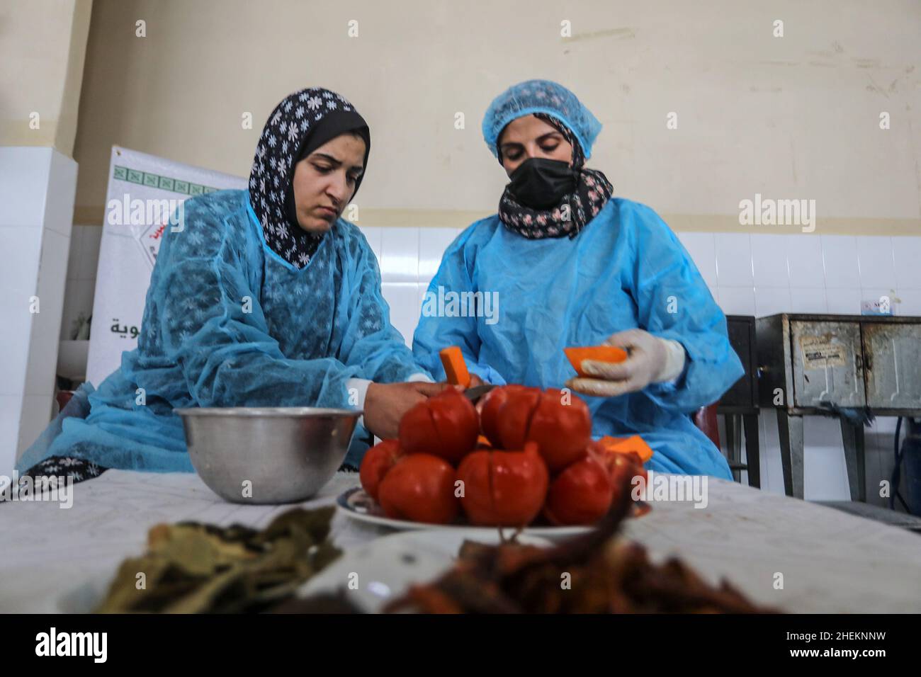 Palestinian women prepare "Maftoul", a traditional couscous dish made ...