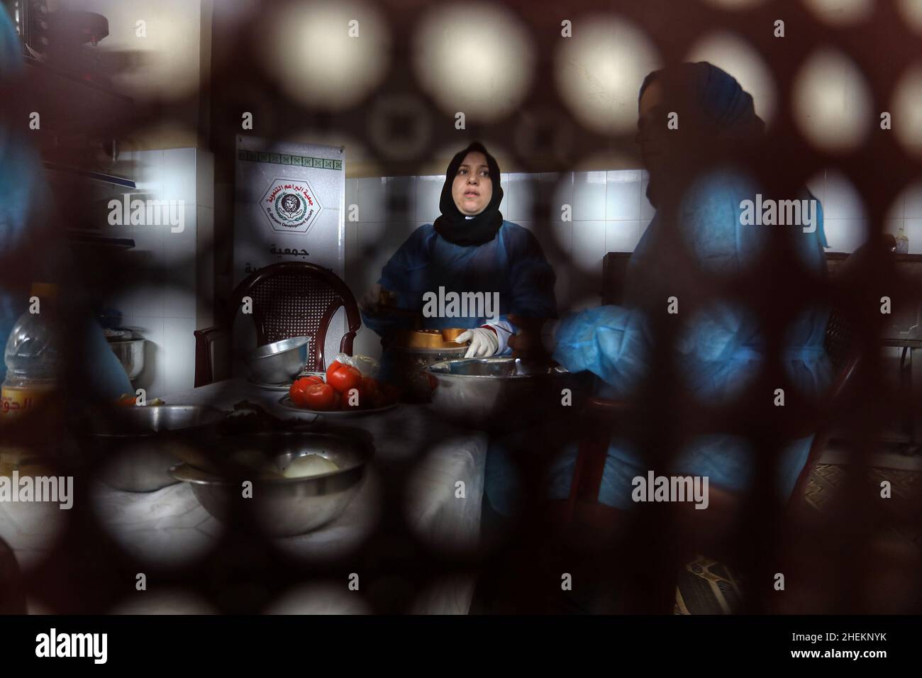 Palestinian women prepare "Maftoul", a traditional couscous dish made ...