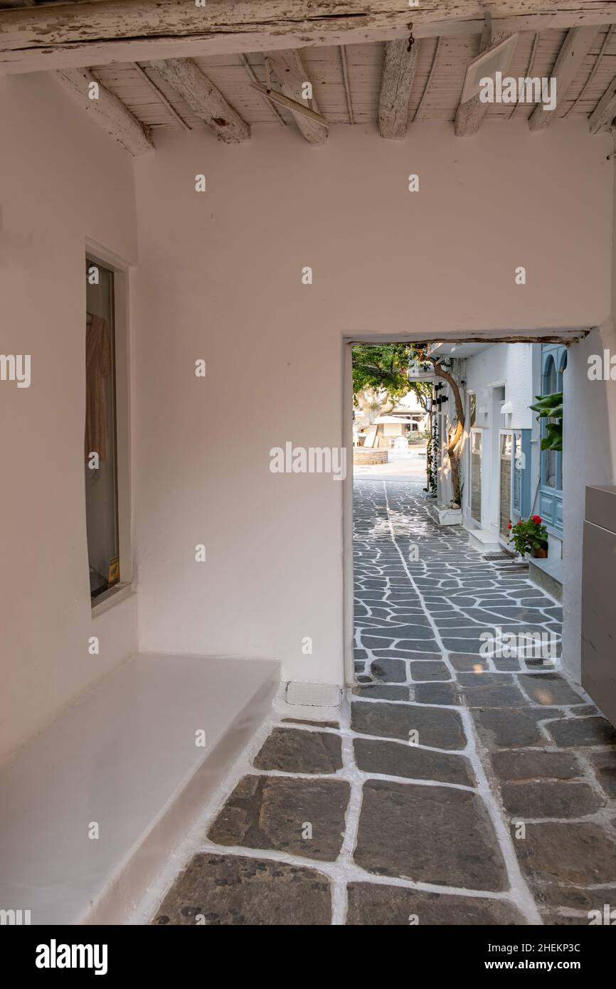 Paros island, Greece. Naousa old town stone paved alley. Whitewashed ...