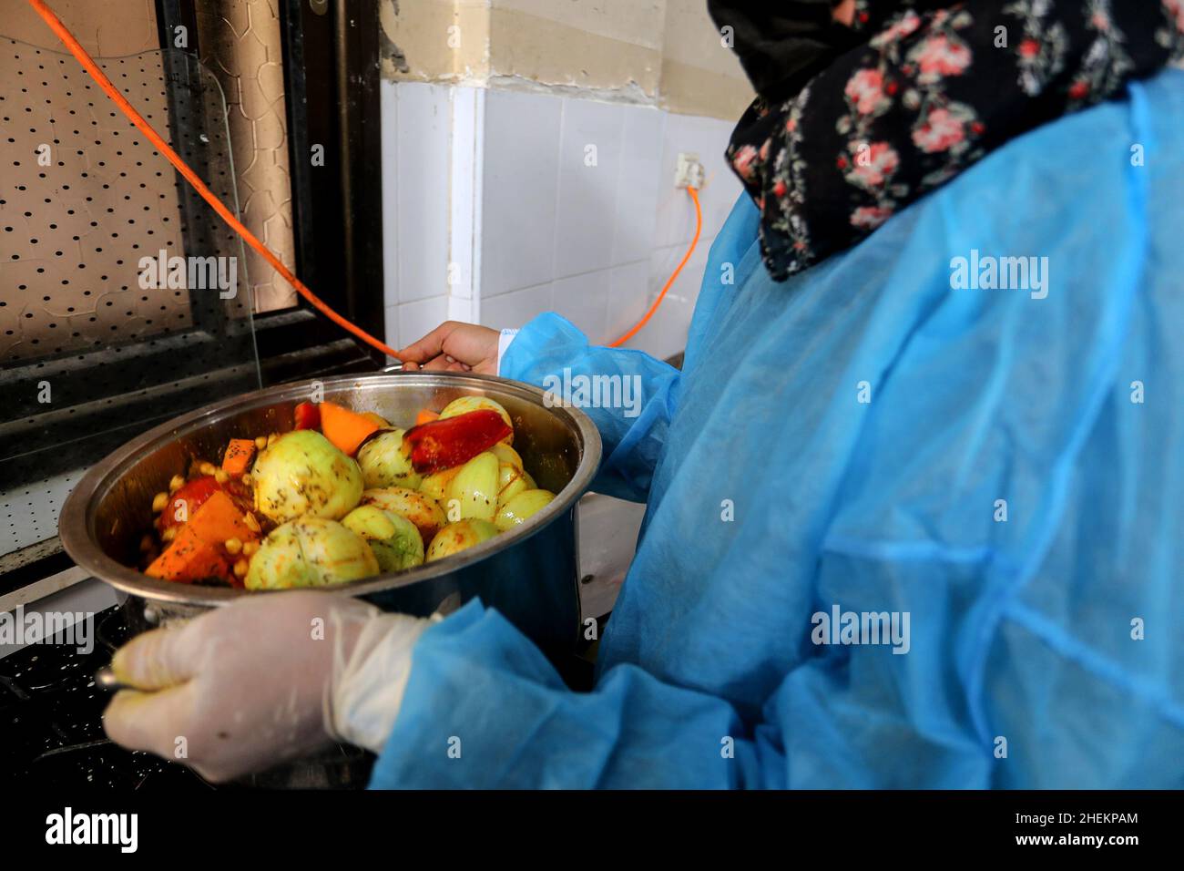 Palestinian women prepare "Maftoul", a traditional couscous dish made ...