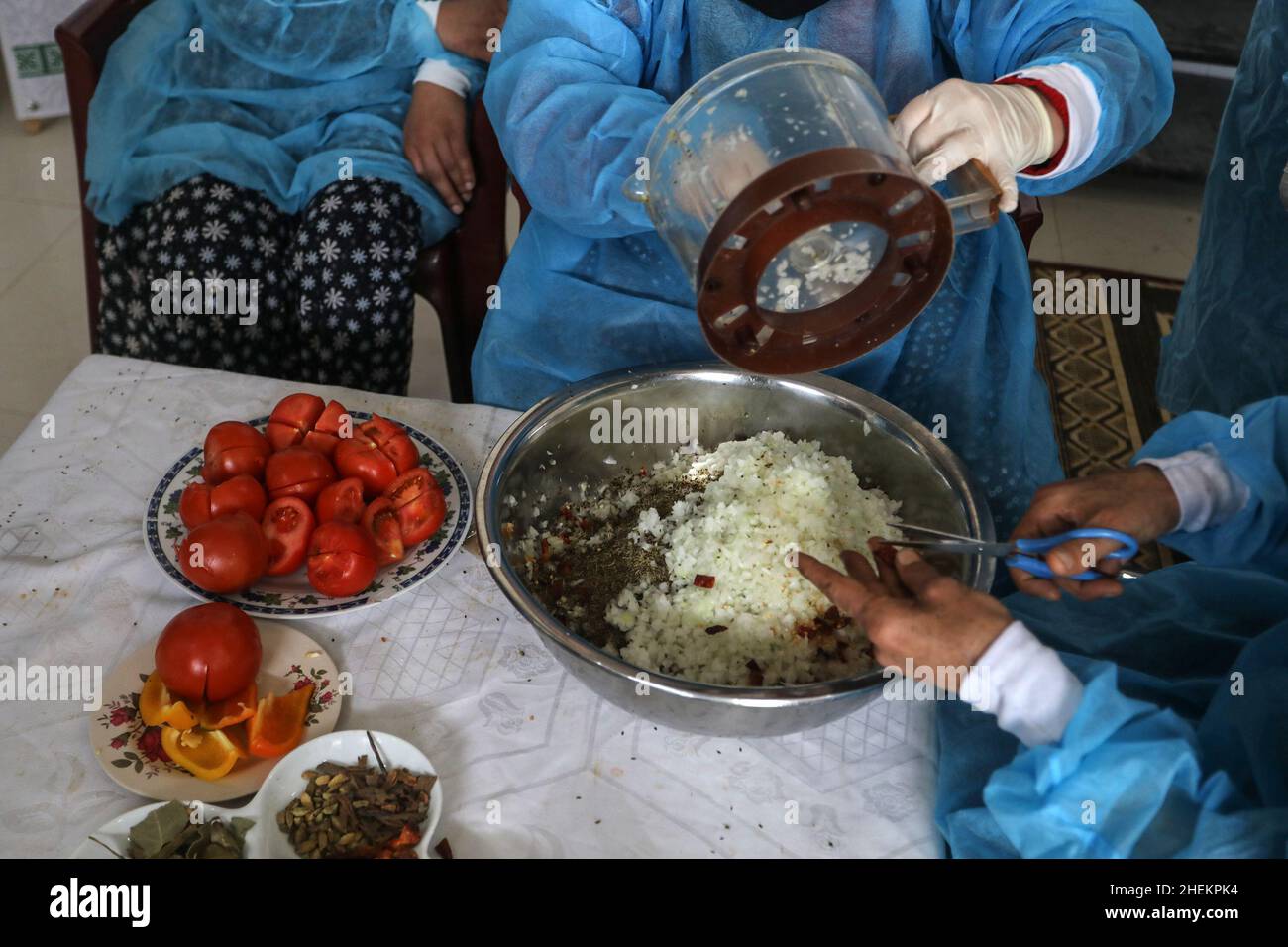 Palestinian women prepare "Maftoul", a traditional couscous dish made ...