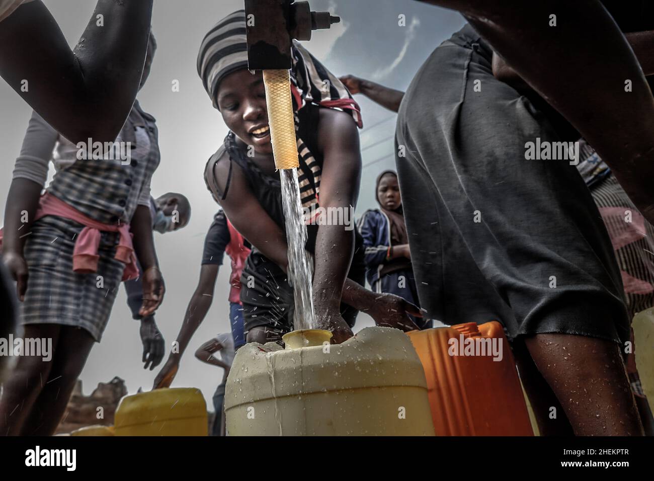 Nairobi, Kenya. 11th Jan, 2022. A woman seen filling up her water ...