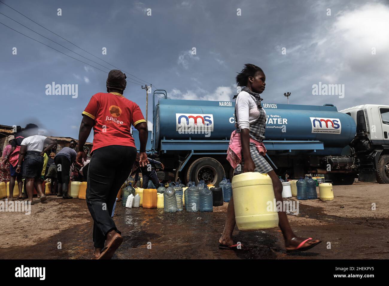 Nairobi, Kenya. 11th Jan, 2022. A woman seen carrying her water ...