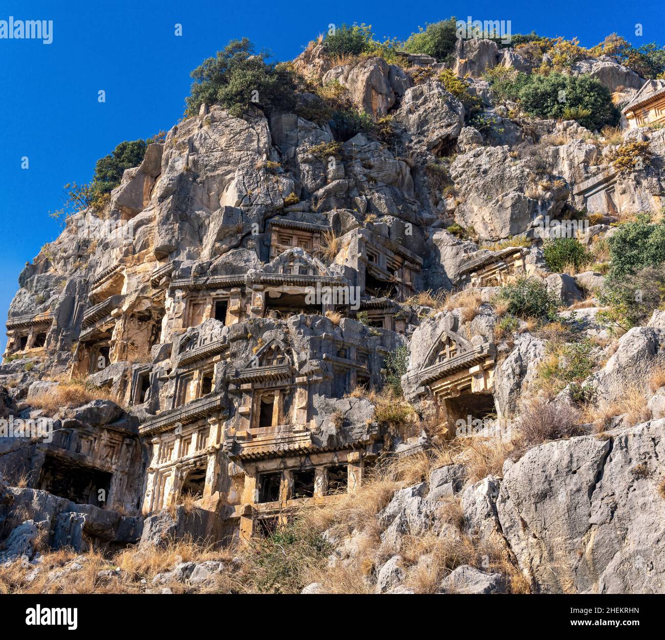 ancient tombs carved into the rocks in the ruins of Myra of Lycia Stock ...