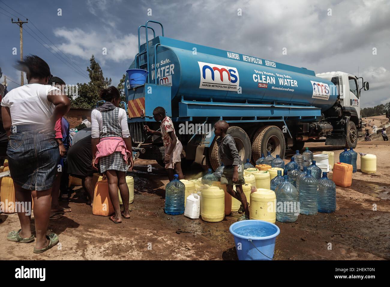 Nairobi, Kenya - 11 Jan 2022 , Local residents seen filling up their ...