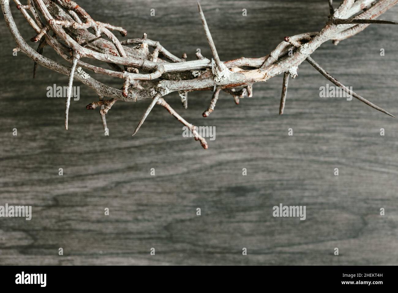 Religion border of partial crown of thorns on a dark wood background ...