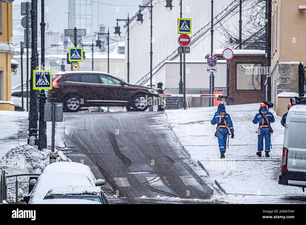 Russia, Moscow. People walk in a street during a snowfall Stock Photo ...