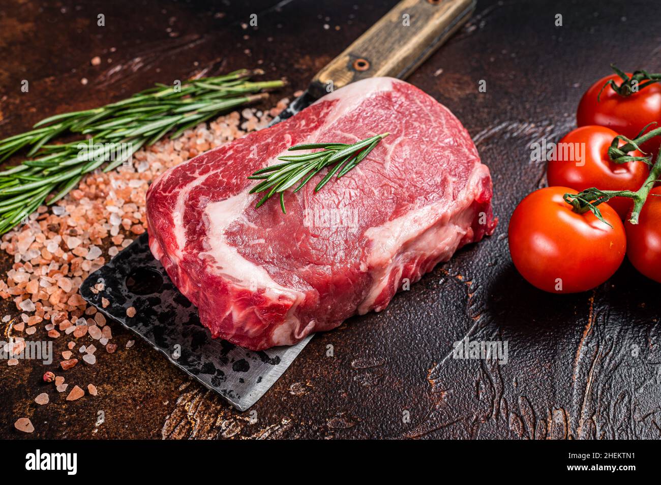 Uncooked raw Rib eye Steak, ribeye beef meat on butcher cleaver with ...