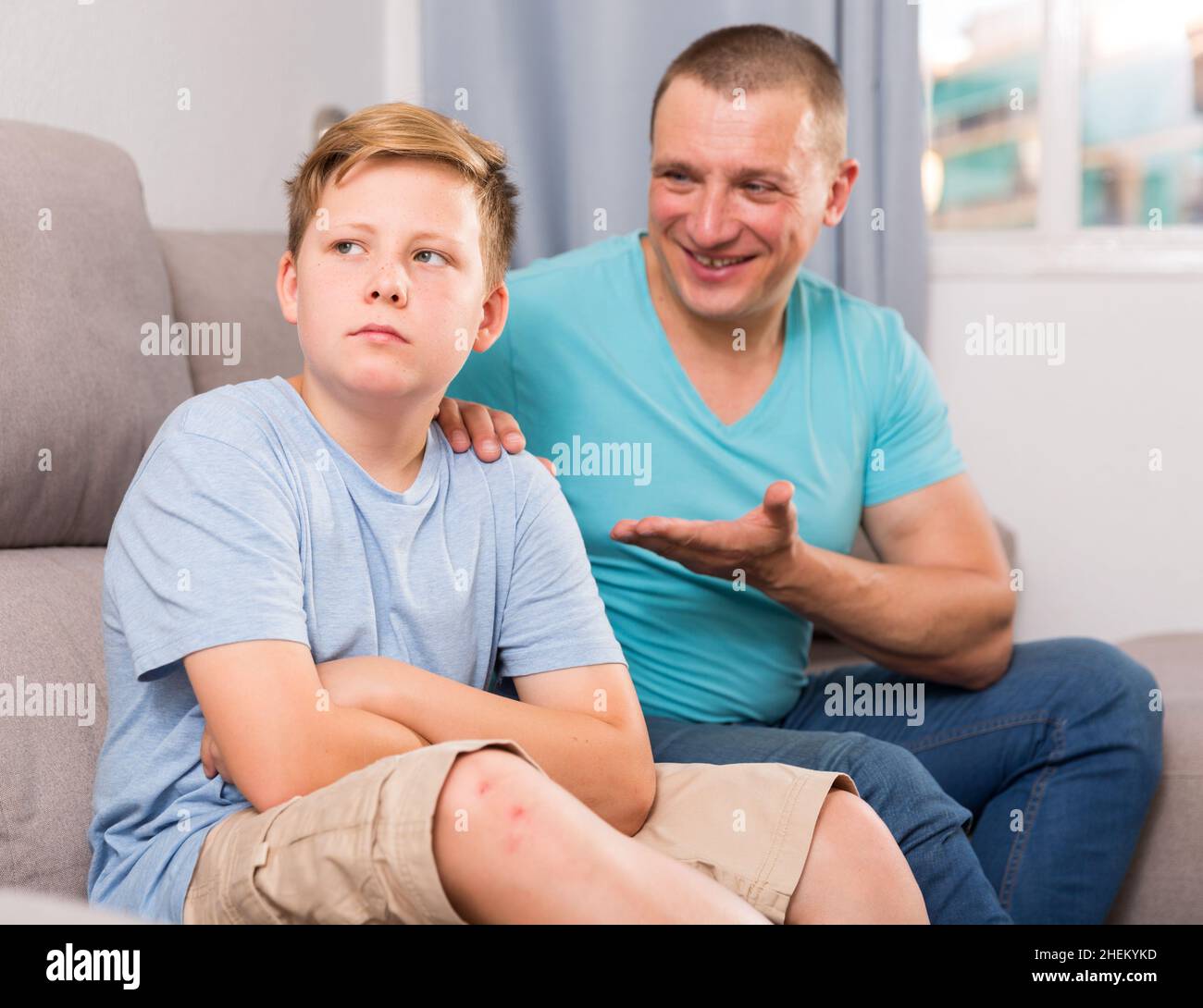 Adult man is asking forgiveness from his sad son after conflict Stock ...