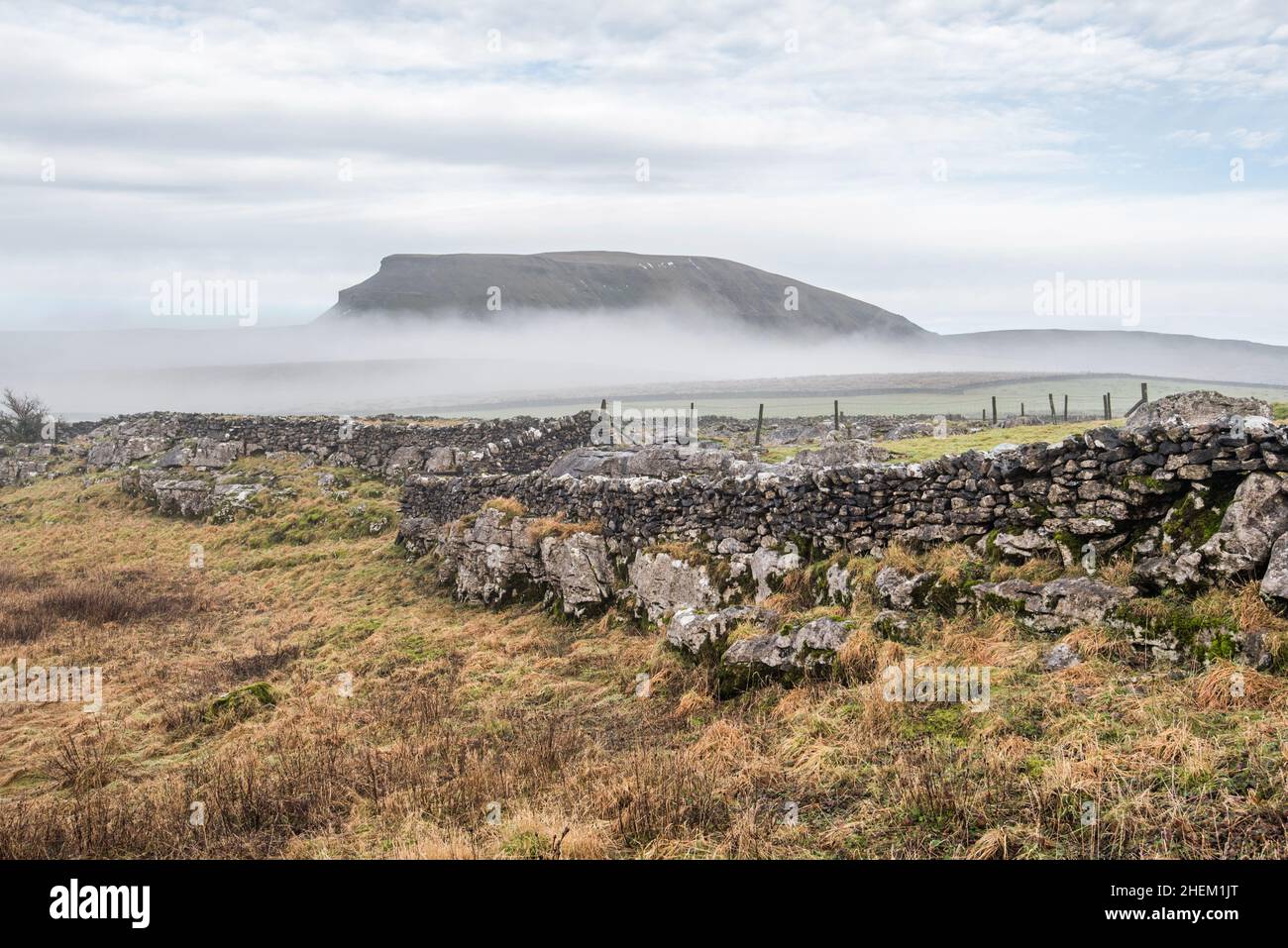 Low lying mist below the summit of Pen-y-Ghent, one of the Three Peaks ...