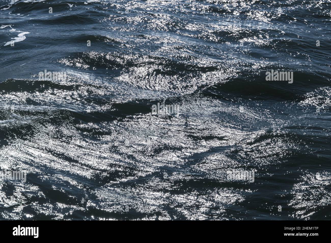 Shiny deep blue sea water with reflections of sunlight, natural ...