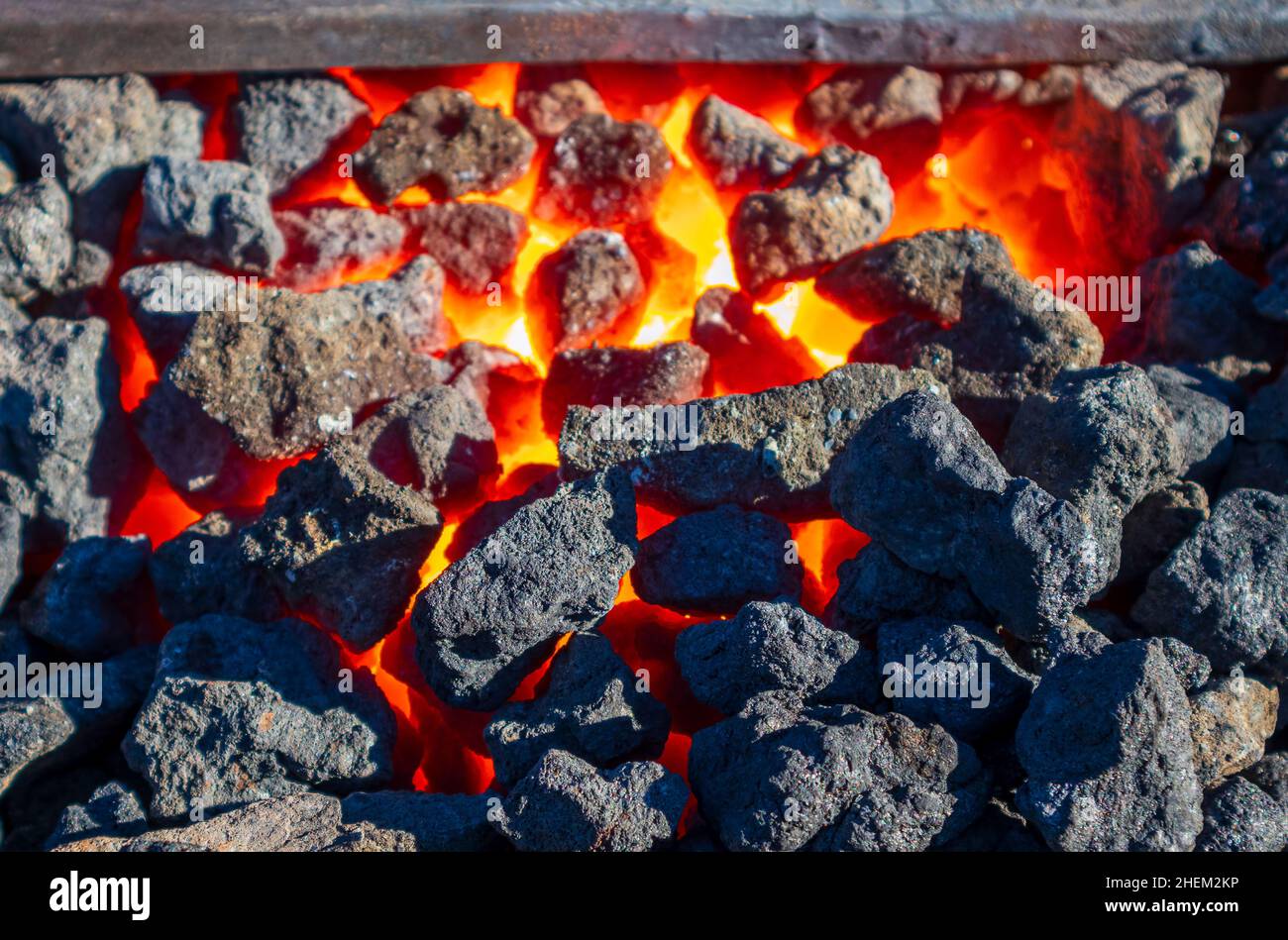 red-hot coke in a forge, closeup photo Stock Photo - Alamy