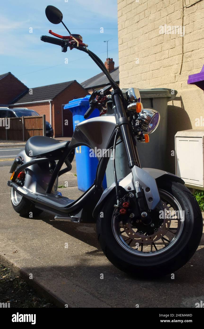 A modern e-bike parked on a driveway in the street Stock Photo - Alamy