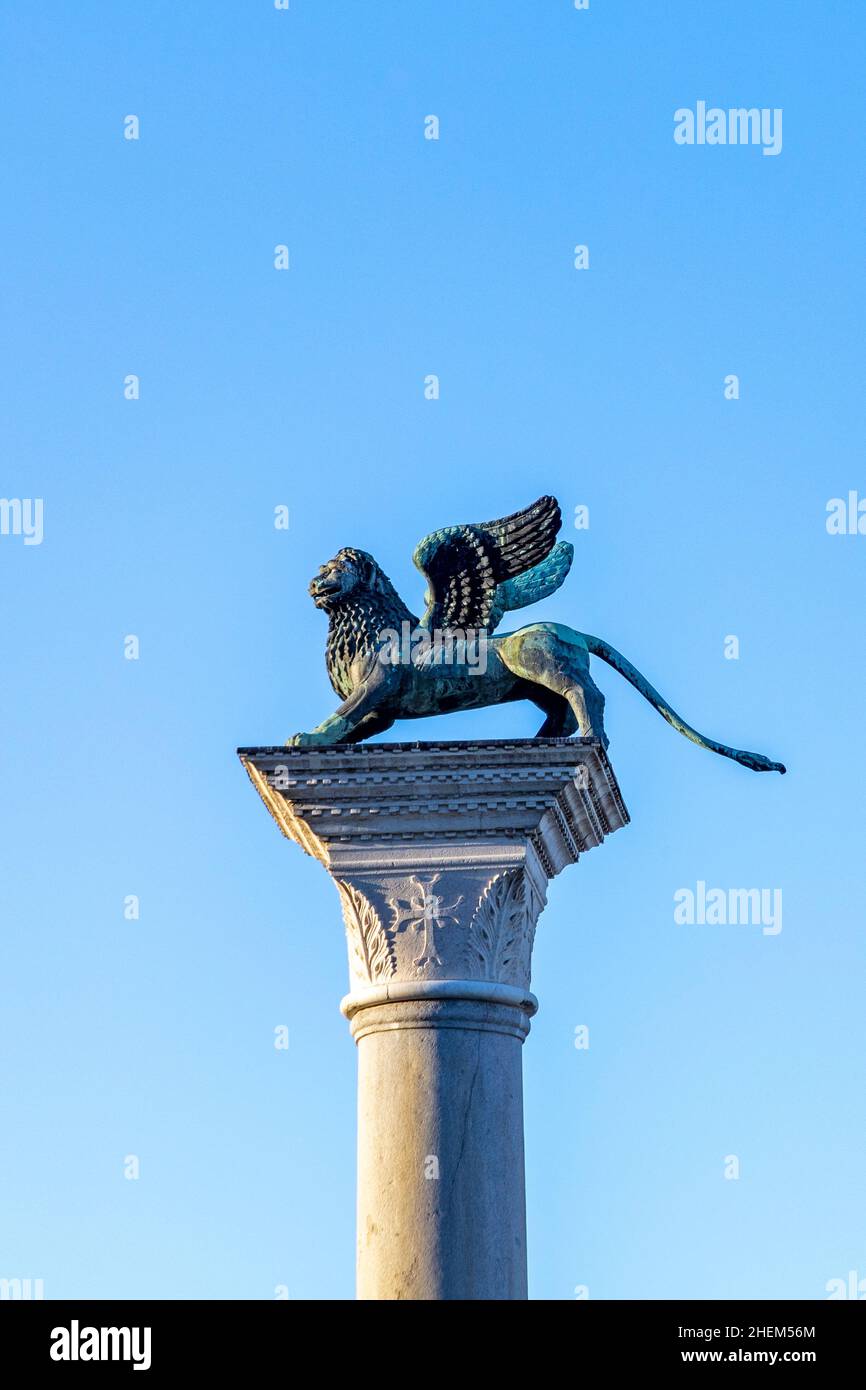 Lion statue at Piazza San Marco (St Mark`s Square) on blue sky ...