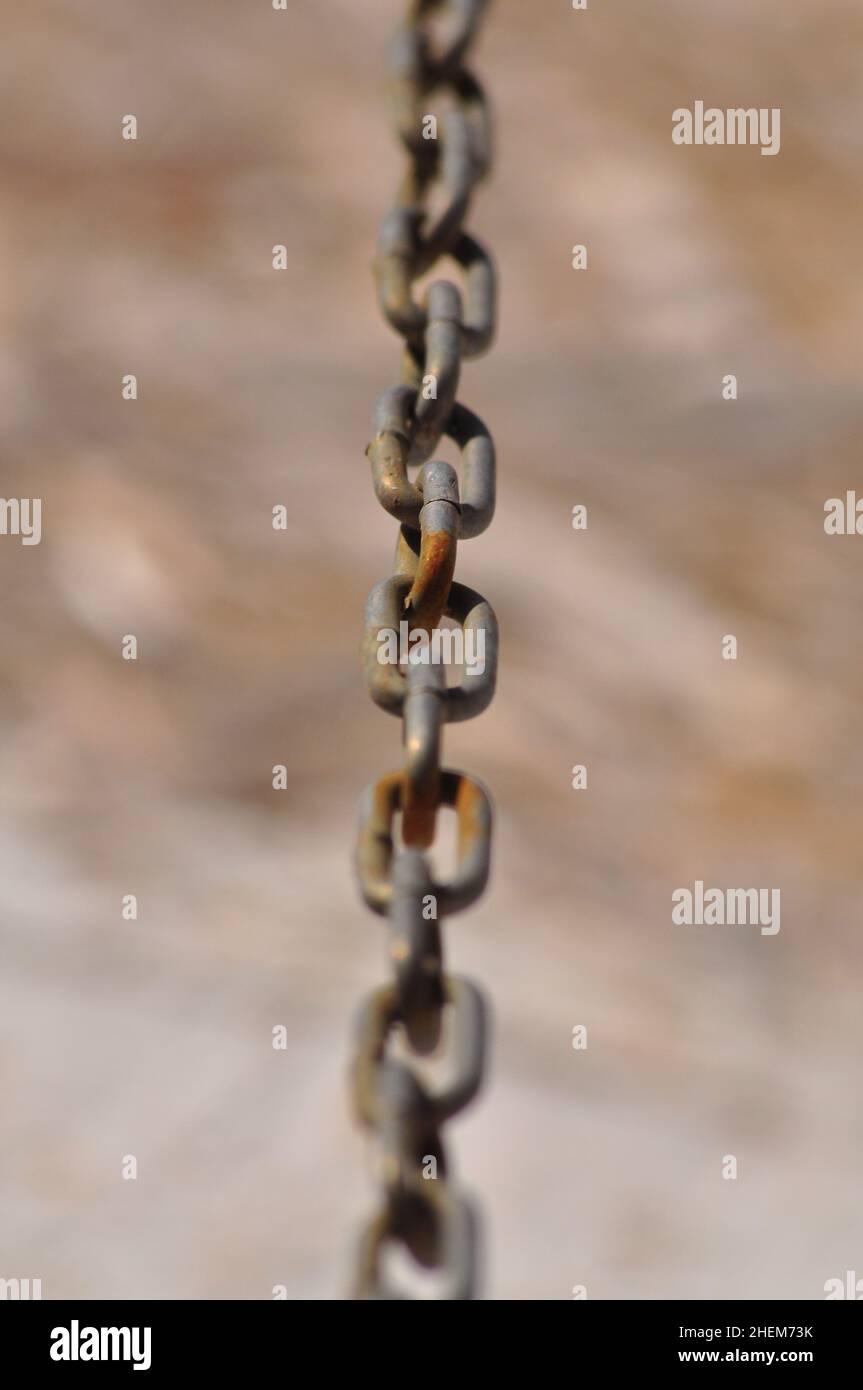 Rusty steel chain shot in perspective with shallow depth of field, soft ...