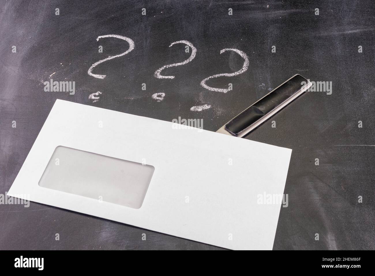 White envelope with letter opener and question mark Stock Photo - Alamy
