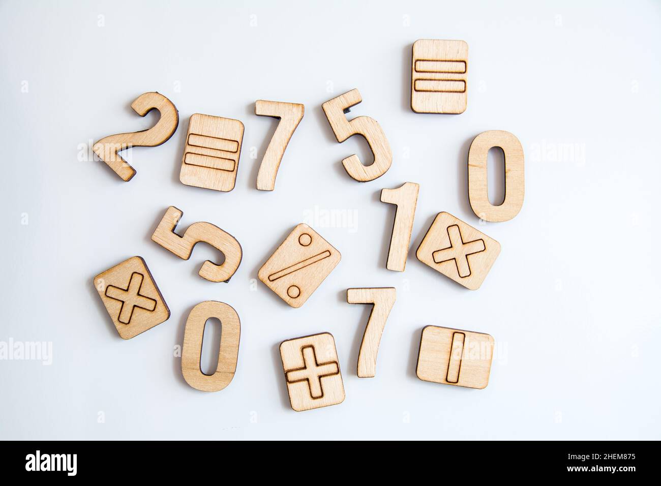 Wooden numbers symbols on white background. Randomly arranged numbers ...