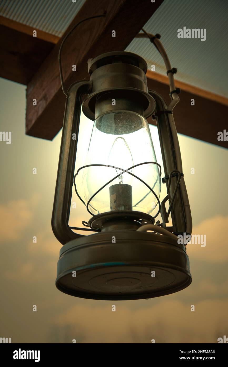 Vintage lamp made like antique kerosene with a light bulb inside ...