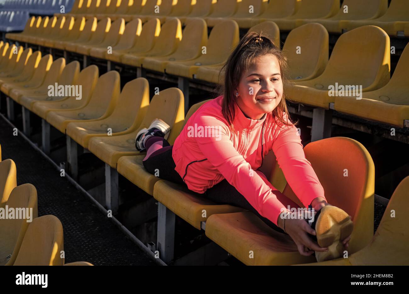 Athletic fit flexible girl child do splits leg stretch gymnastic ...