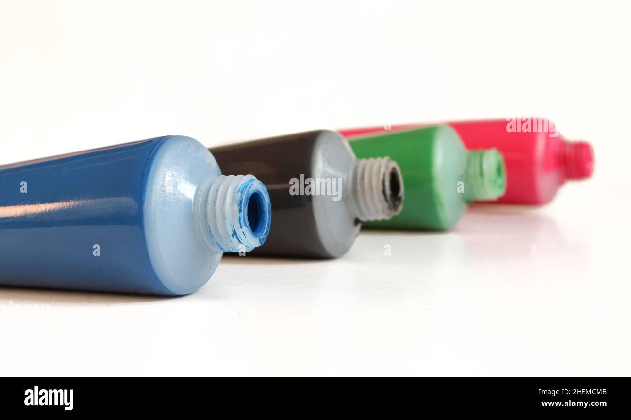 Set of open color tubes isolated on white background. Closeup Stock ...