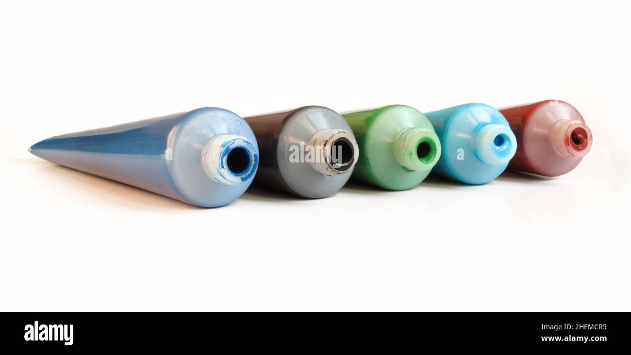 Set of open color tubes isolated on white background. Closeup Stock ...