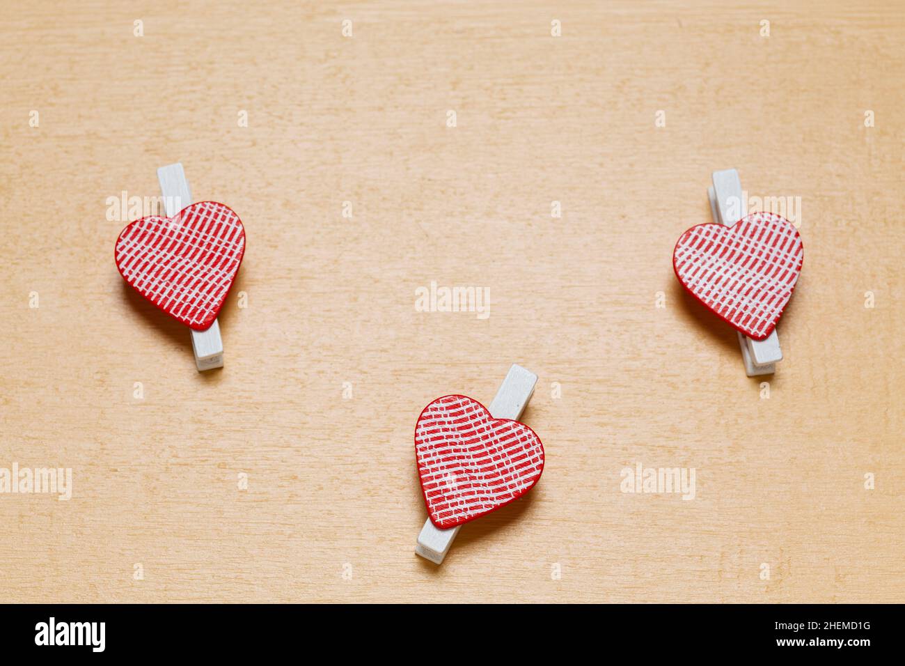 Minimalistic simple Valentine`s day card, little red hearts on beige ...