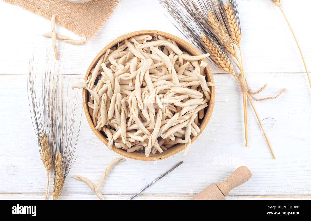 Whole grain wheat raw apulian pasta called Pizzarieddi or maccaruni in ...