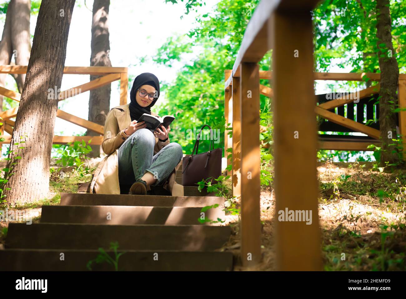 Intelligent female researcher reading in silence Stock Photo - Alamy