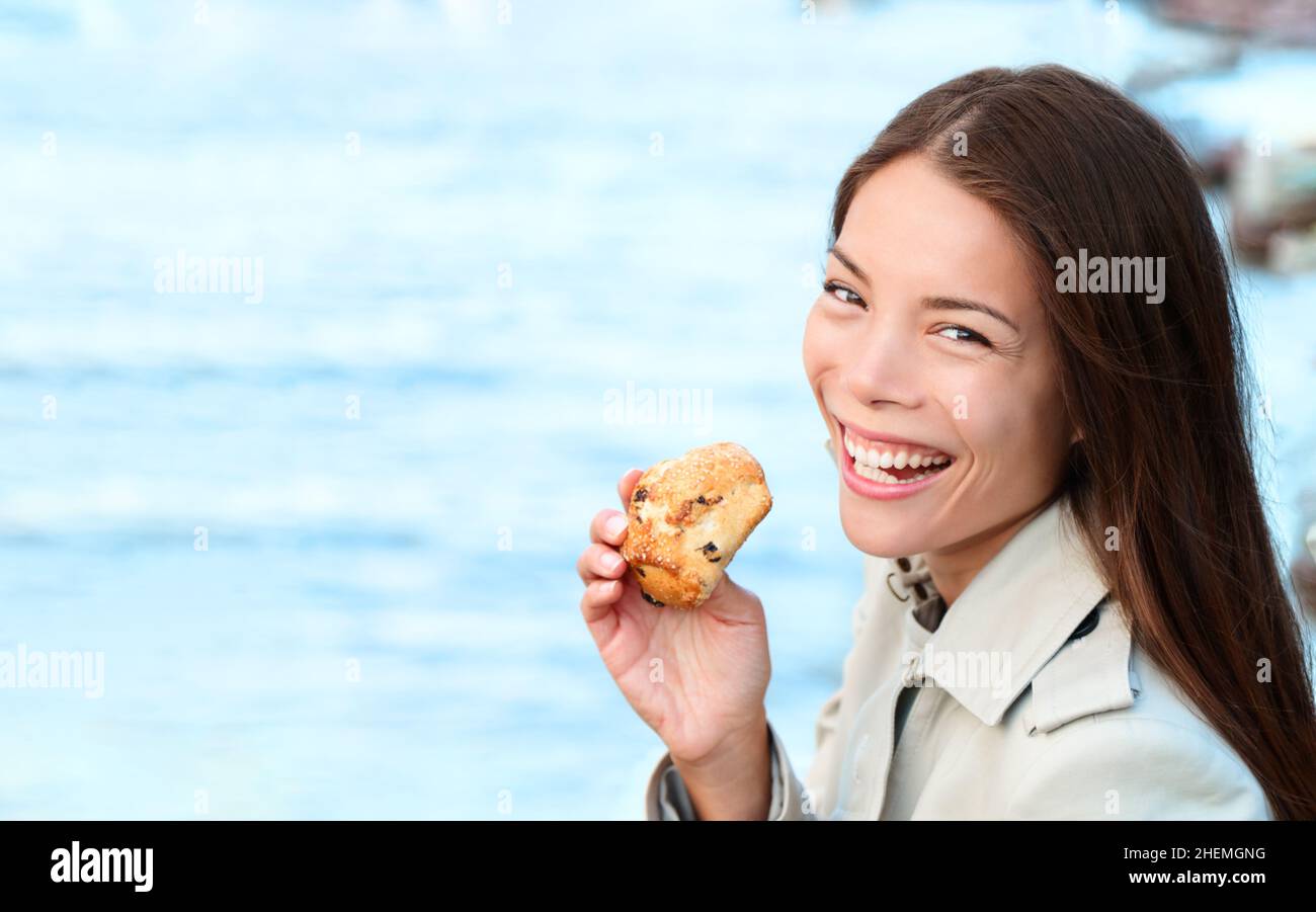 Scone pastry Asian woman eating british cake dessert by the sea ...