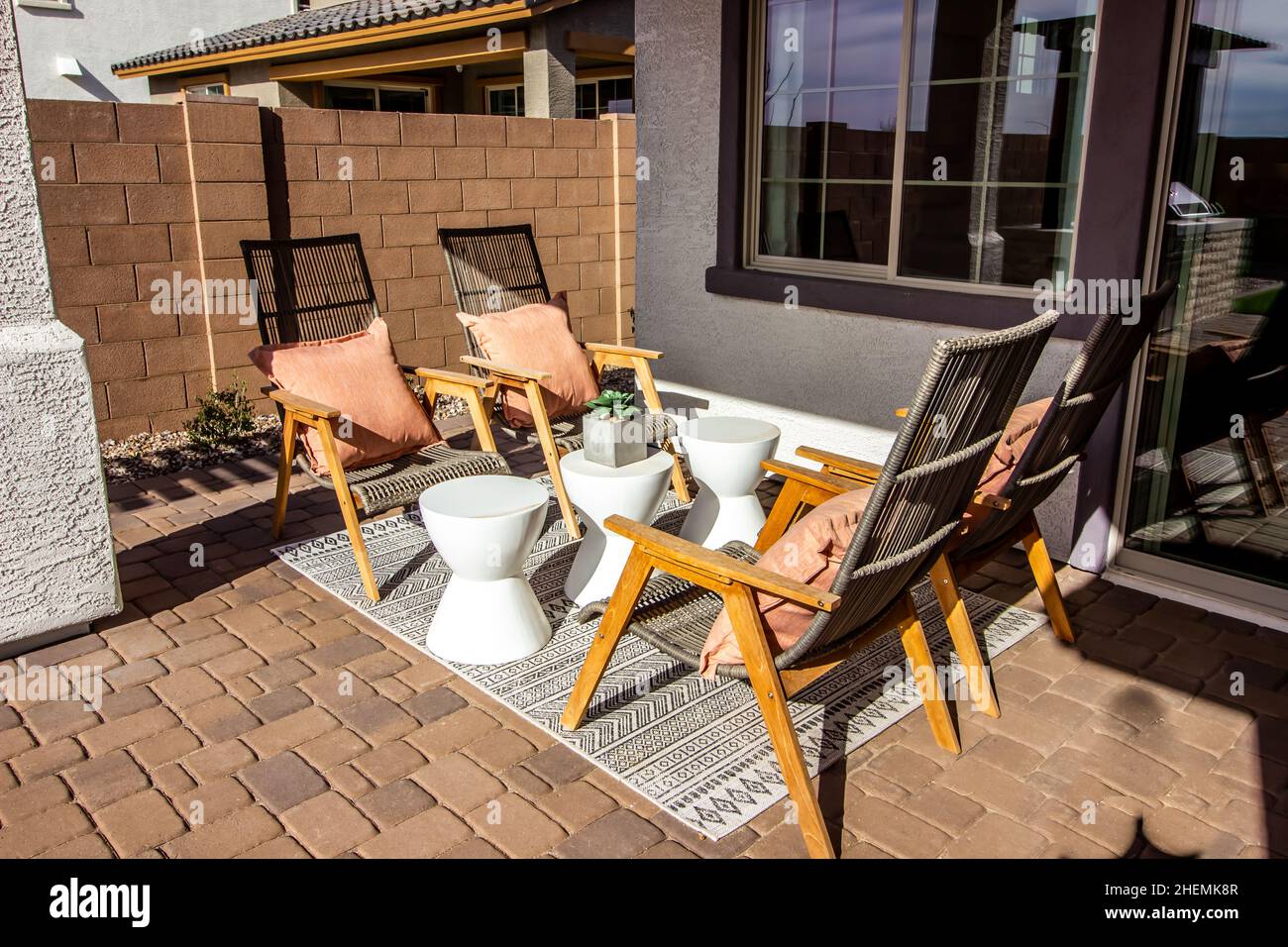 Conversation Area With Four High Back Chairs On Pavers Stock Photo - Alamy