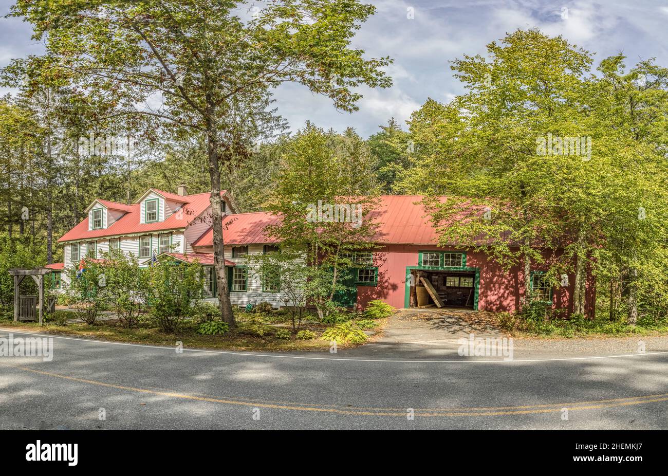 typical wooden building with trees and street in Williamsville, Vermont ...