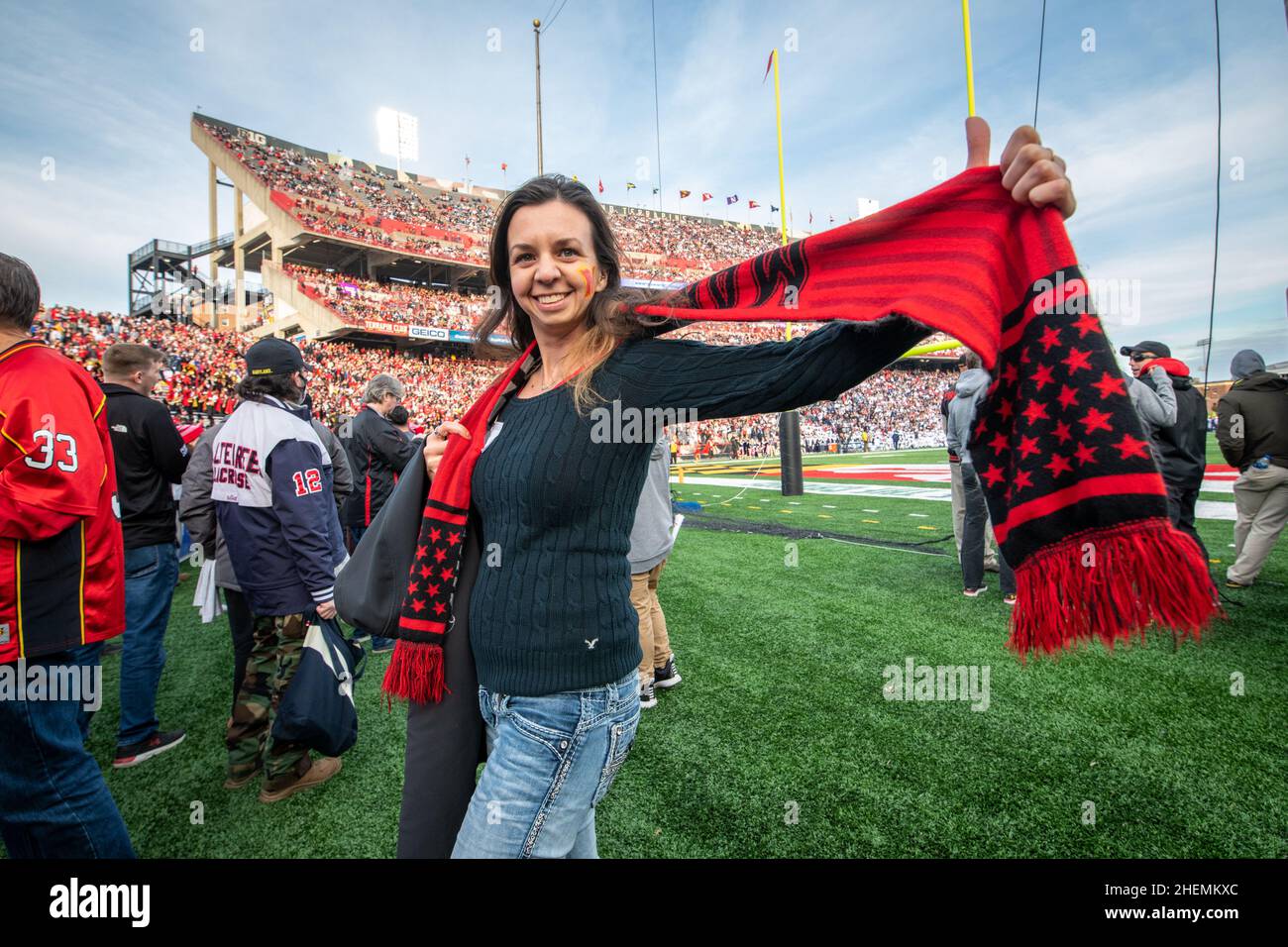 A fan on the side line shows UMD spirit with a Maryland scarf Stock ...