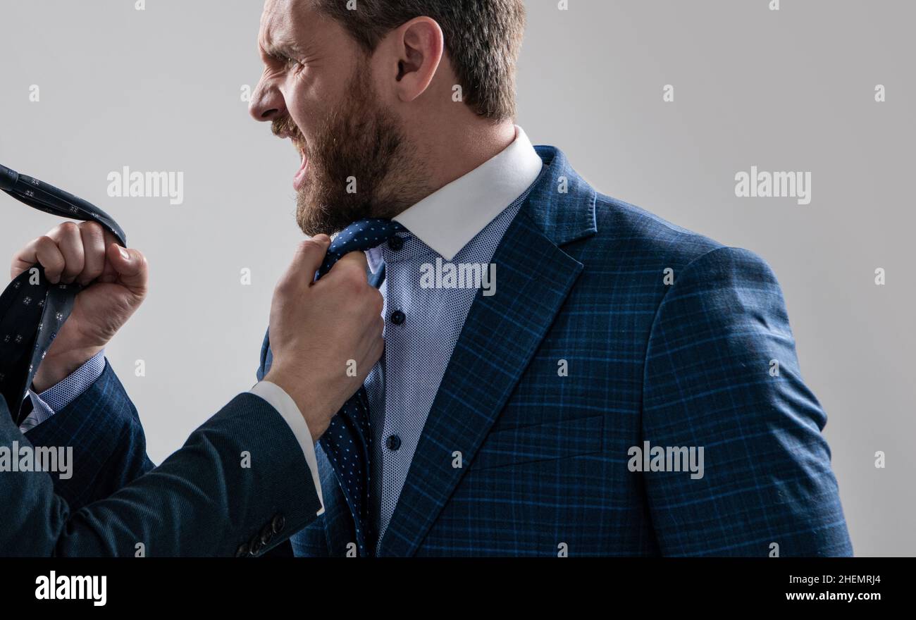 Experiencing aggression at work. Angry professional man fight with ...