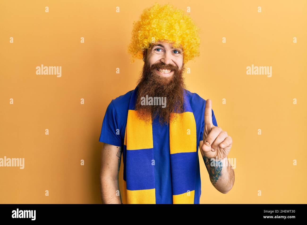 Redhead man with long beard football hooligan cheering game wearing ...
