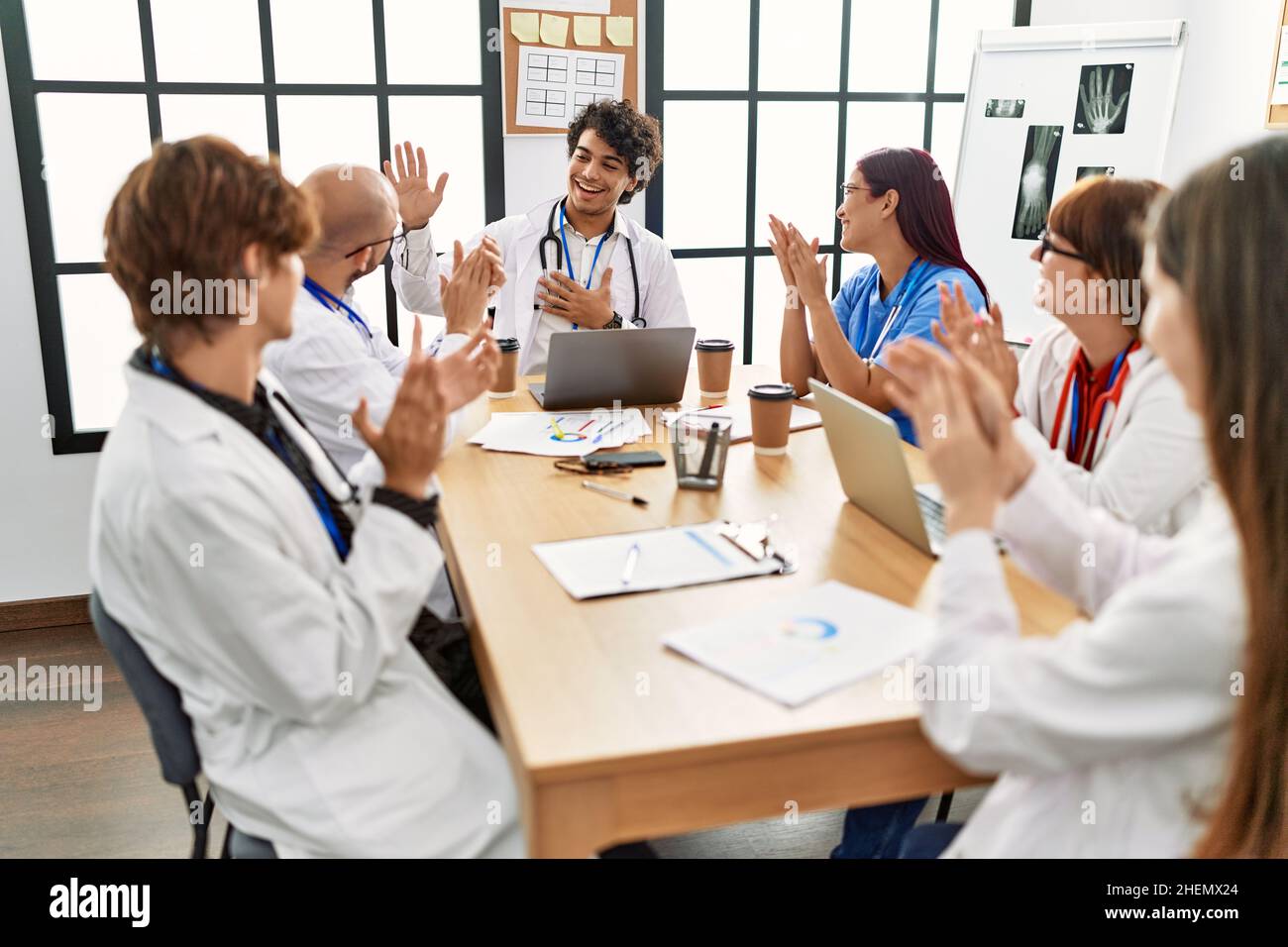 Group of doctor smiling and clapping to partner in a medical meeting at ...
