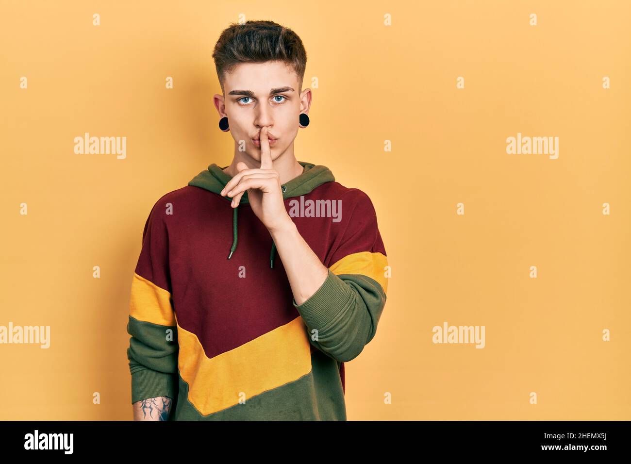 Teenager boy gesture shh hi-res stock photography and images - Alamy