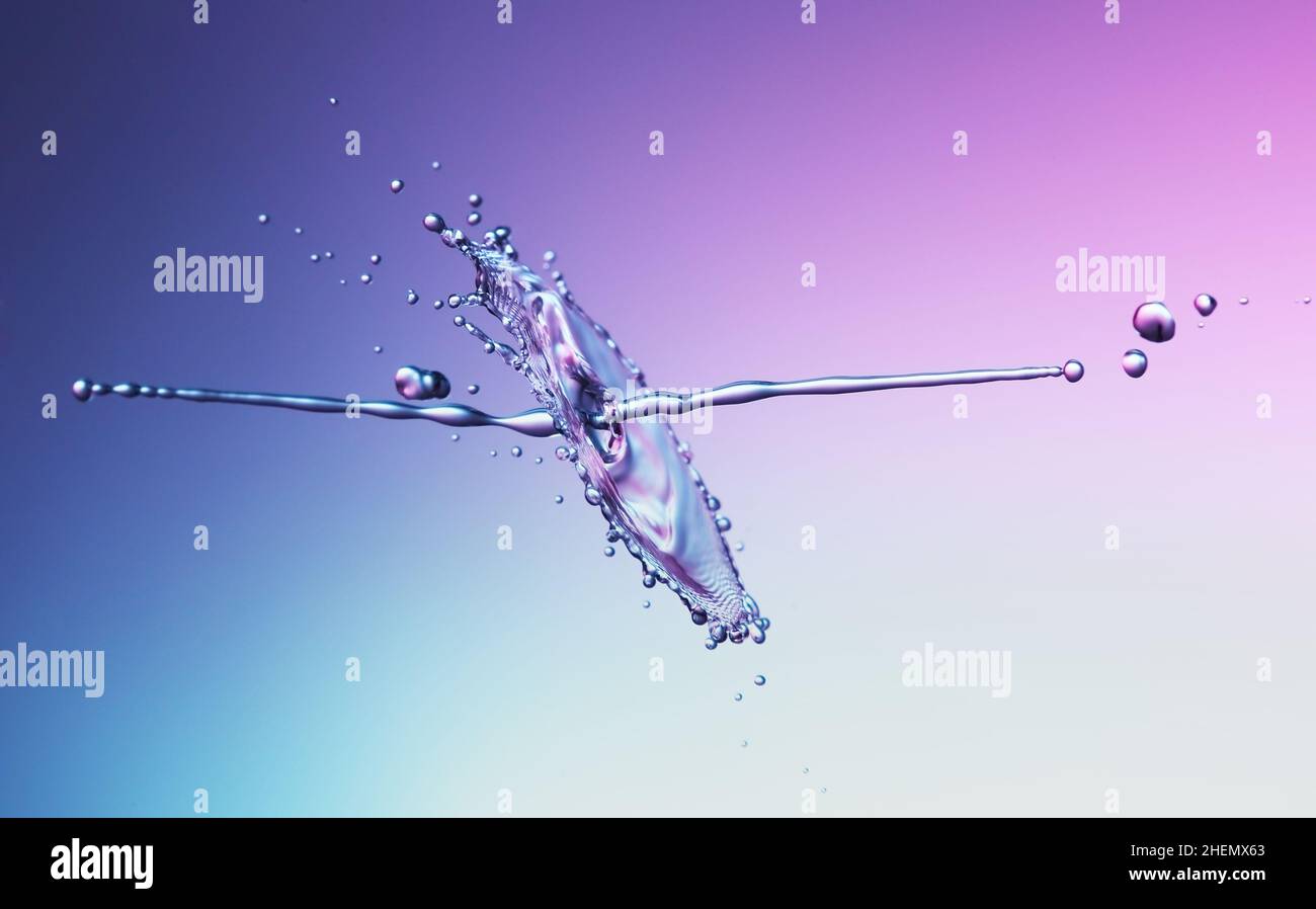 Clear water liquid splash on a blue background Stock Photo - Alamy