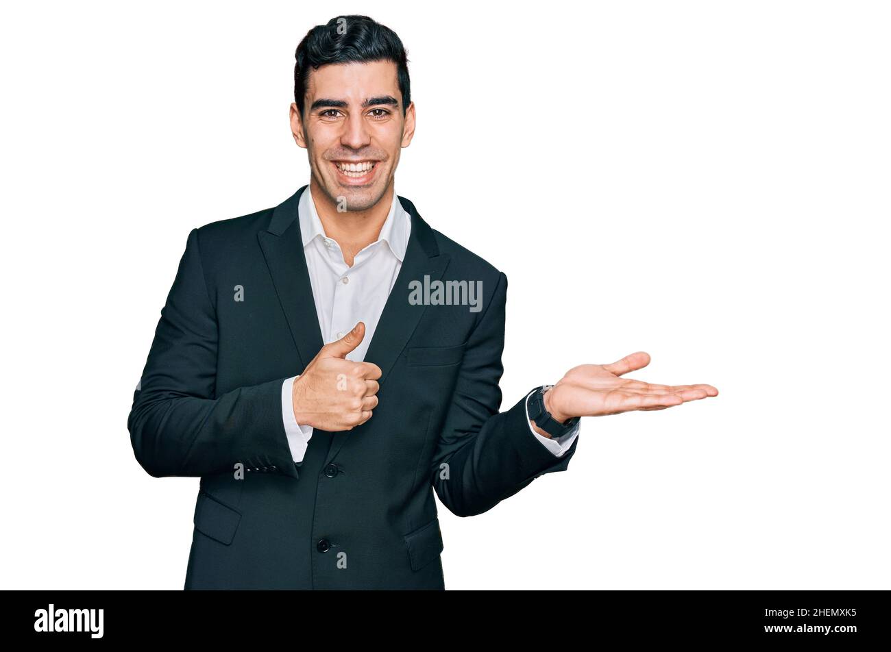 Handsome hispanic man wearing business clothes showing palm hand and ...