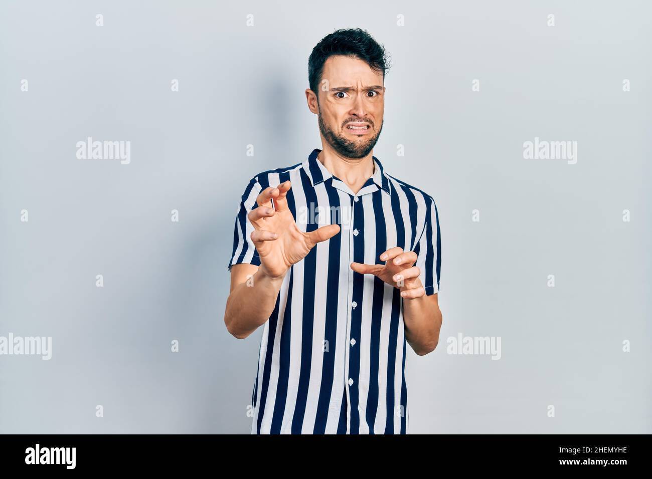 Young hispanic man wearing casual clothes disgusted expression ...