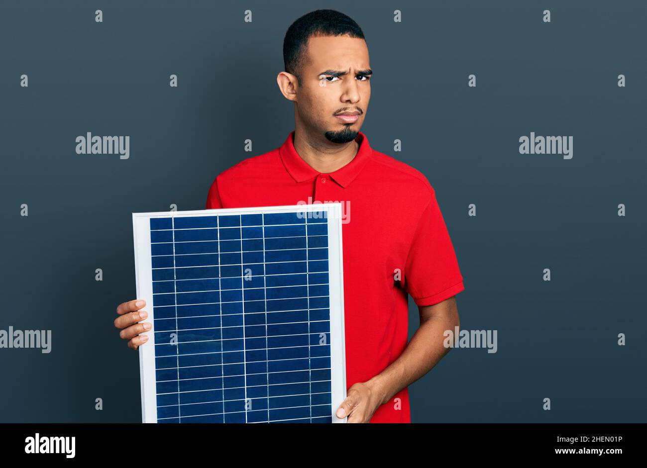 African man holding solar panel hi-res stock photography and images - Alamy