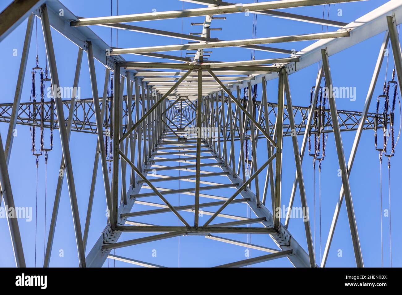 gray electric pylon under clear blue sky Stock Photo - Alamy